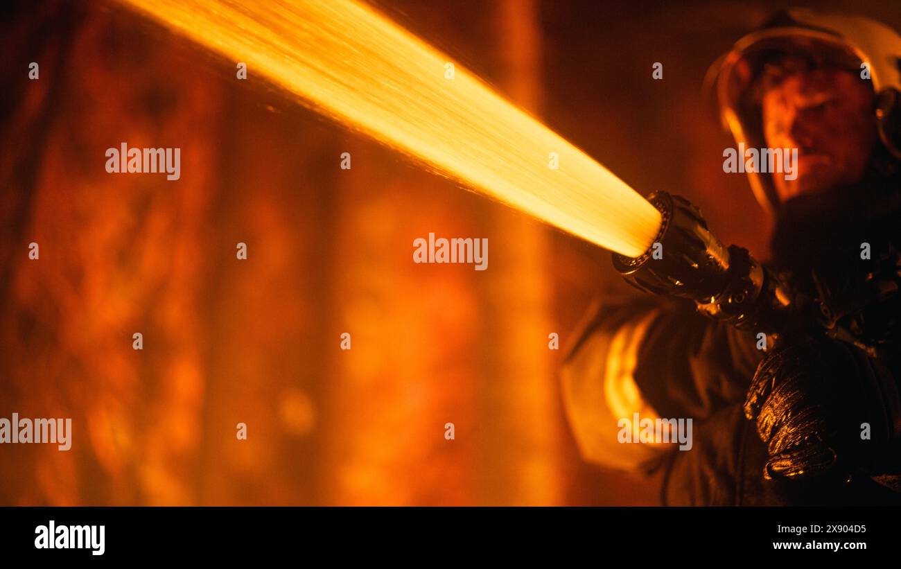 Close Up Low Angle Portrait of a Brave Professional Firefighter Using a ...