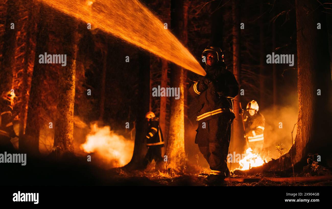 Experienced African American Firefighter Extinguishing a Wildland Fire ...