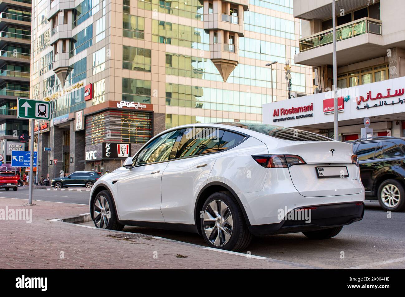 Close-up of white Tesla Model Y in the street in Dubai City. UAE Stock ...