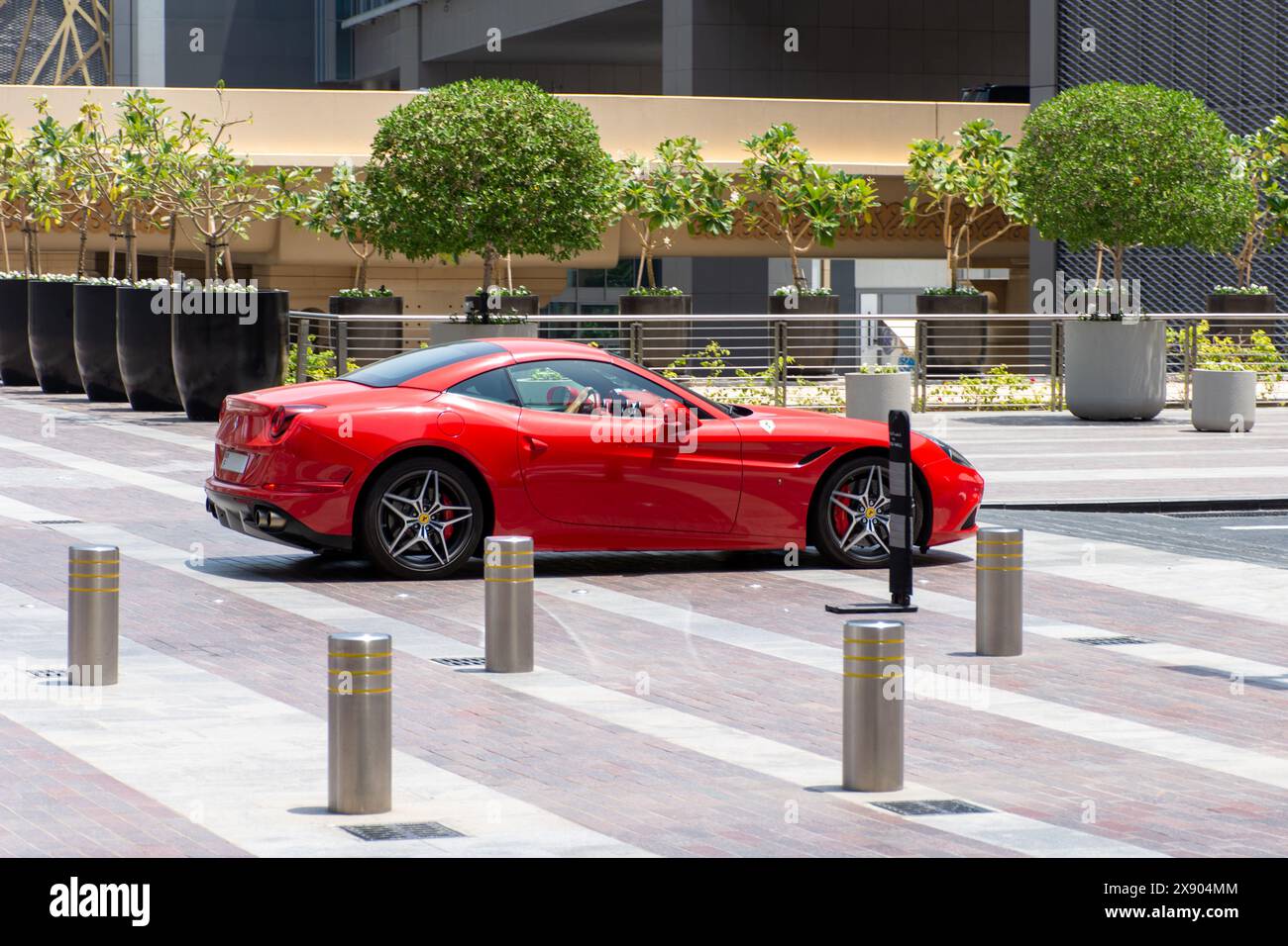 Close-up of red Ferrari F8 Tributo parked in Dubai Mall Stock Photo - Alamy