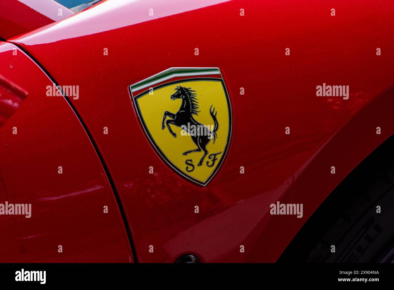 Close-up of Ferrari logo on the side part of red car Stock Photo - Alamy