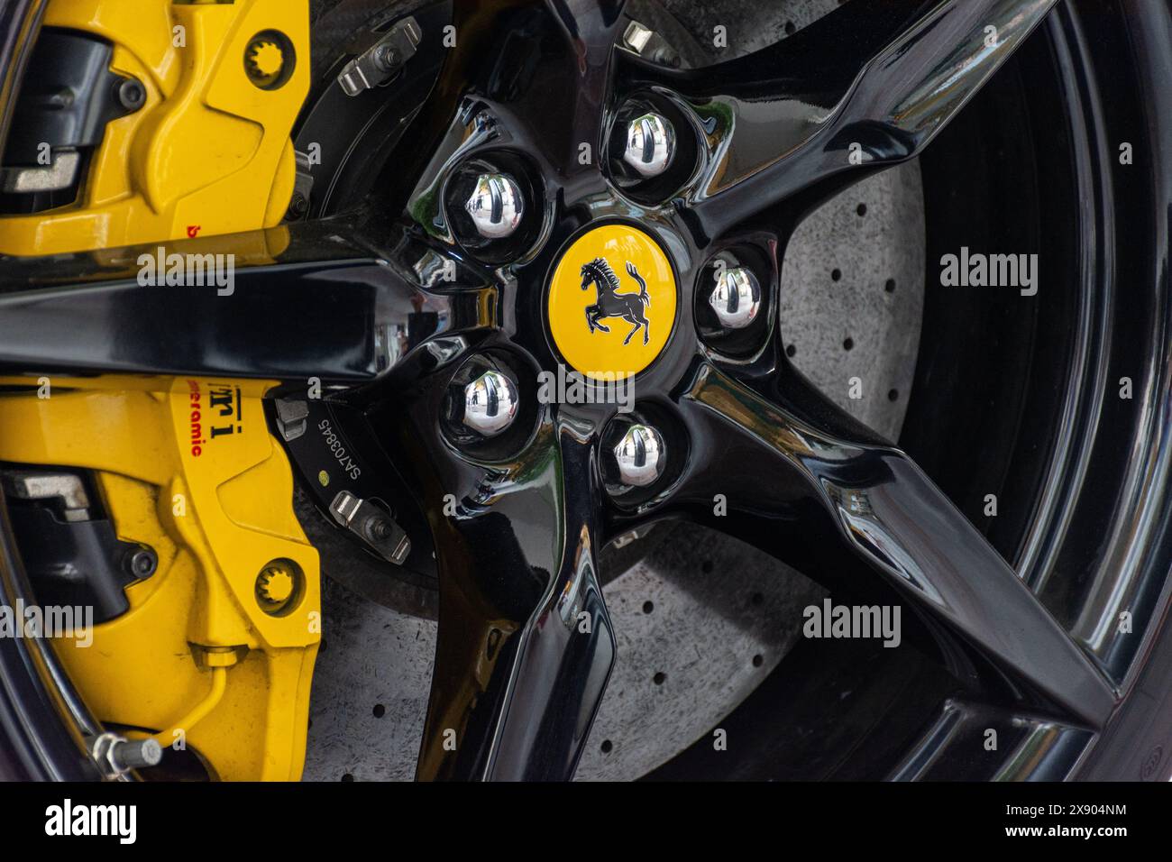 Close-up of Ferrari alloy wheel with logo Stock Photo - Alamy