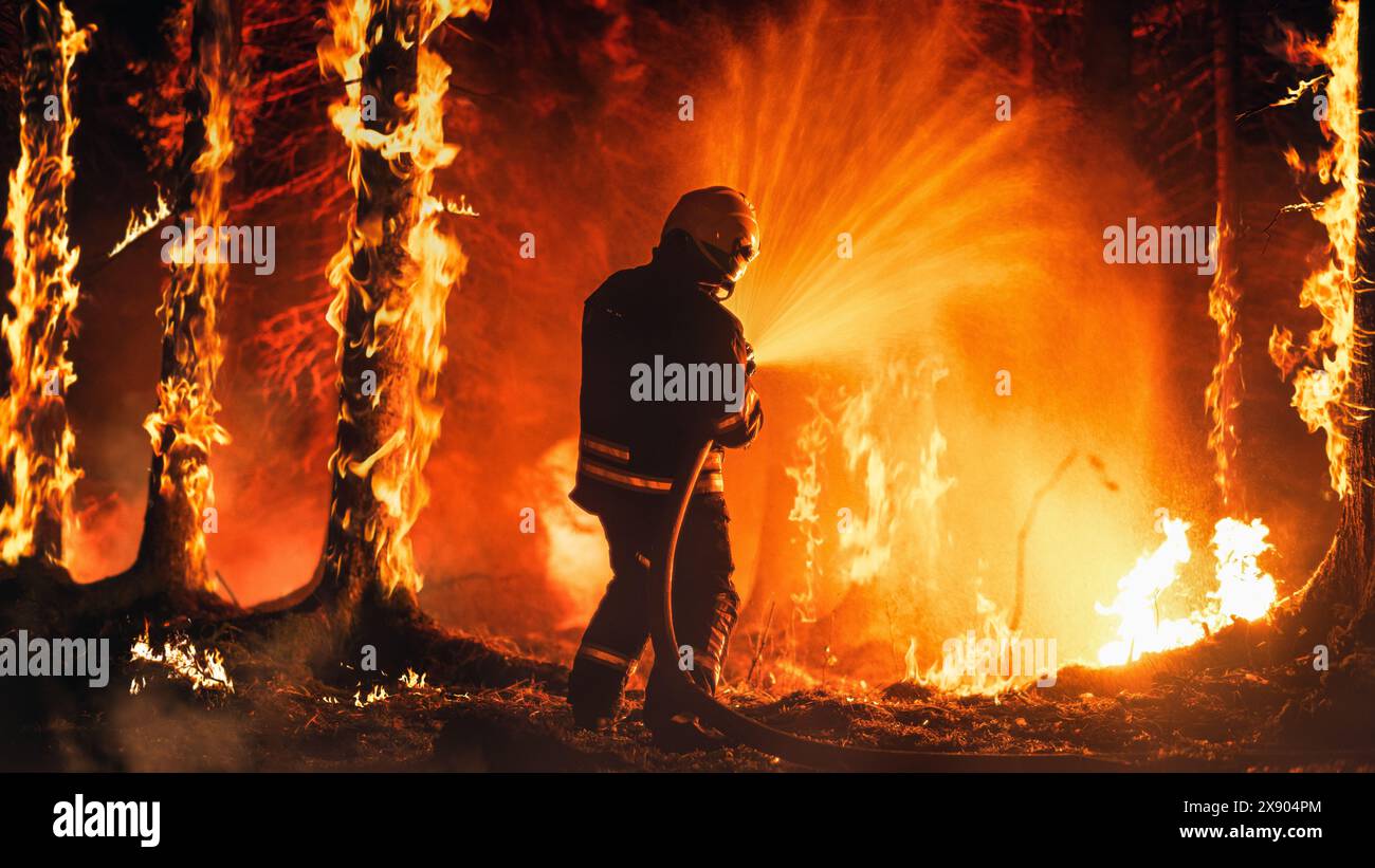 Professional Firefighter Extinguishing Large, High-Priority Part of the ...