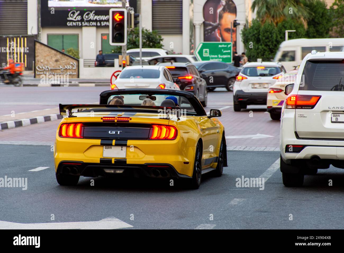 Rear view of yellow Ford Mustang GT in the street in Dubai City Stock ...