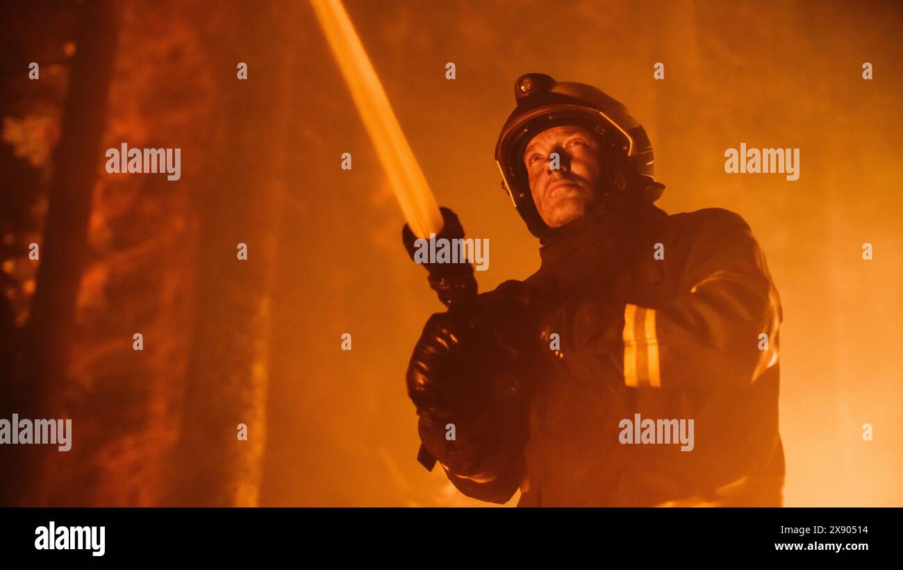 Experienced Firefighter Extinguishing a Wildland Brushfire Deep in the ...