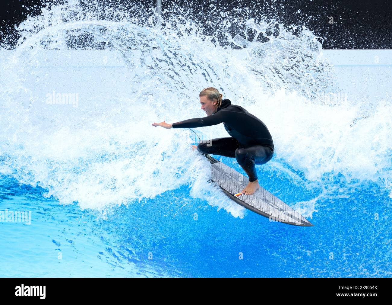 28 May 2024, Bavaria, Hallbergmoos: Tim Elter, surfer, surfs before the ...