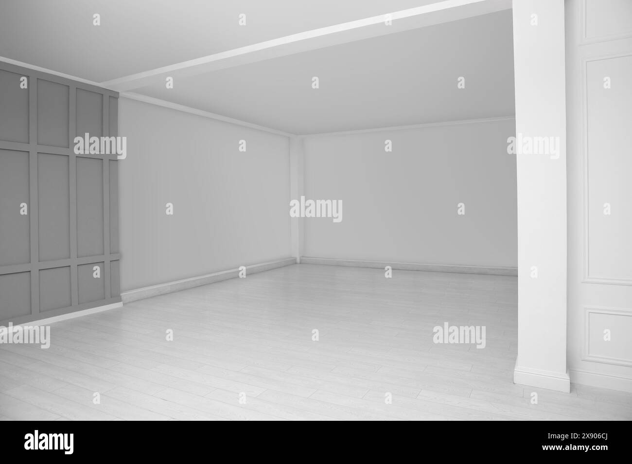 Empty room with grey wall and laminated floor Stock Photo - Alamy