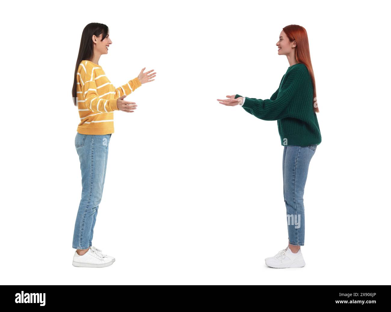 Two women talking on white background. Dialogue Stock Photo - Alamy