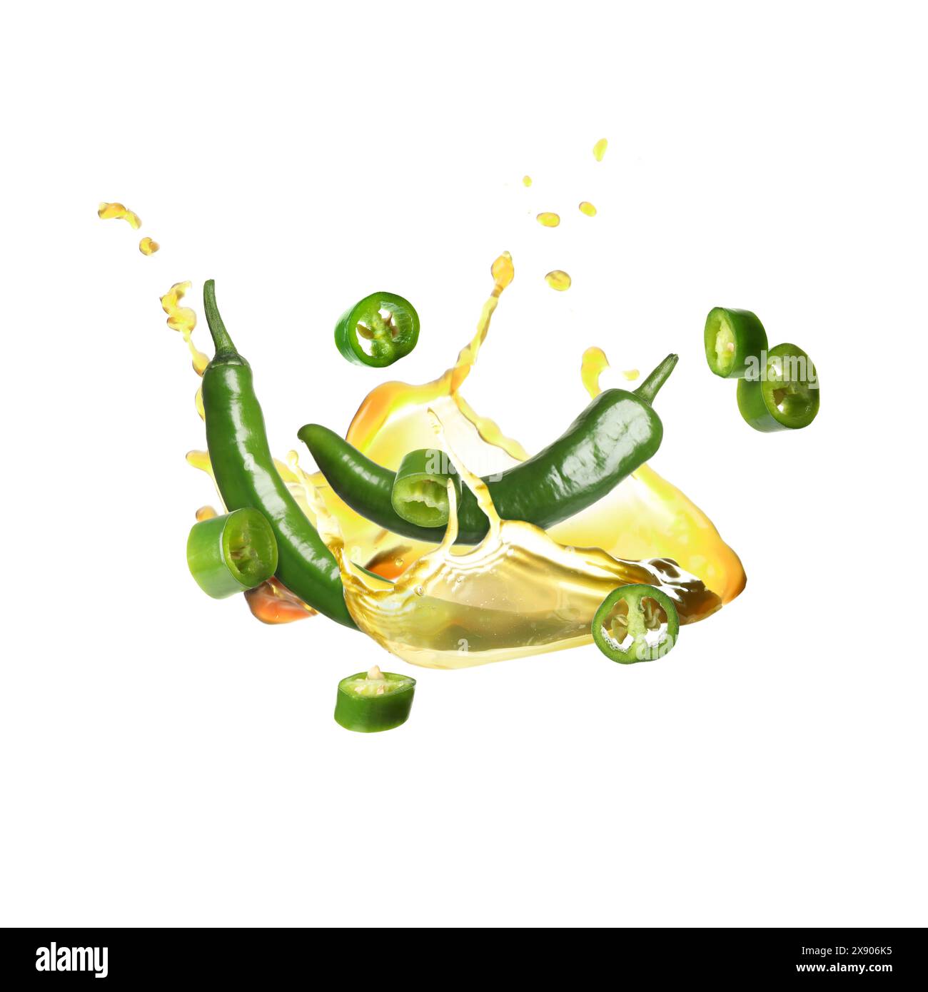 Splash of cooking oil and green chili pepper isolated on white Stock ...