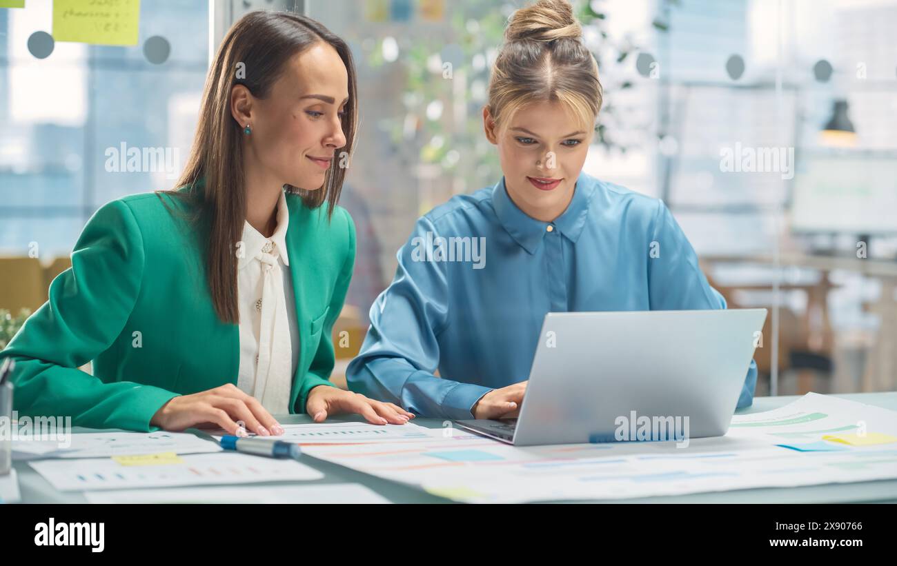Portrait of Two Caucasian Smiling Women Collaborating and Working on a ...