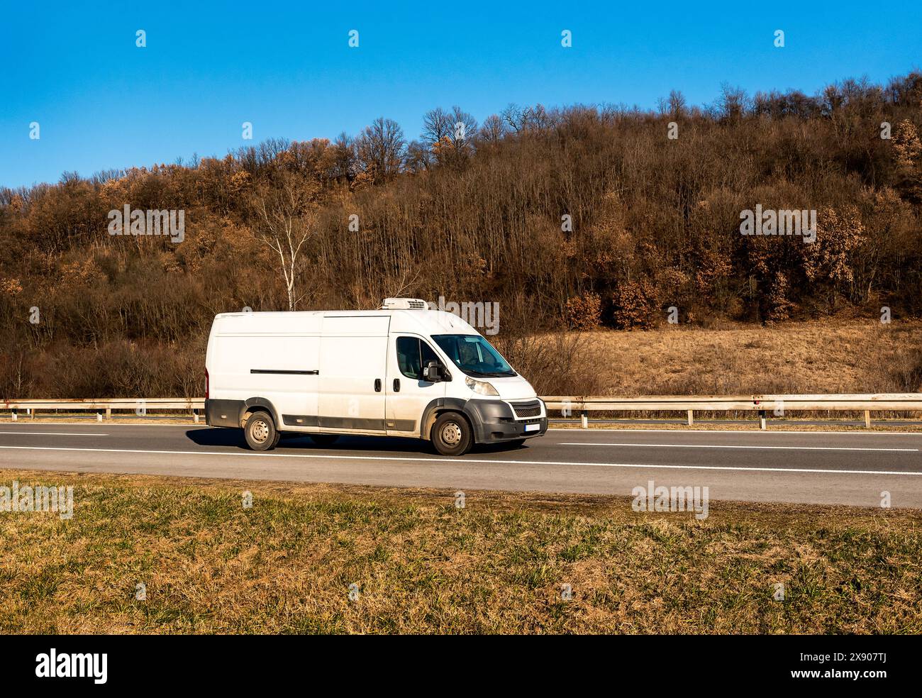 White cargo van at the open highway Stock Photo - Alamy