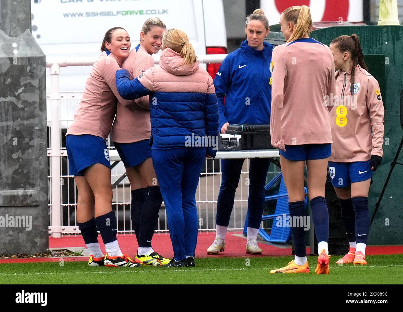 England's Grace Clinton (left) hugs Alessia Russo during a training ...