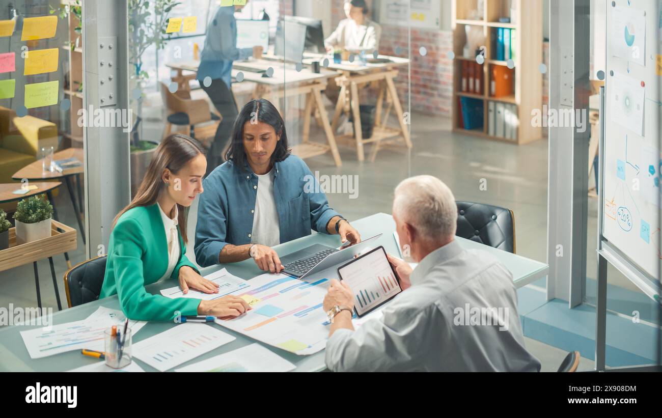 Diverse group colleagues collaborating in hi-res stock photography and ...
