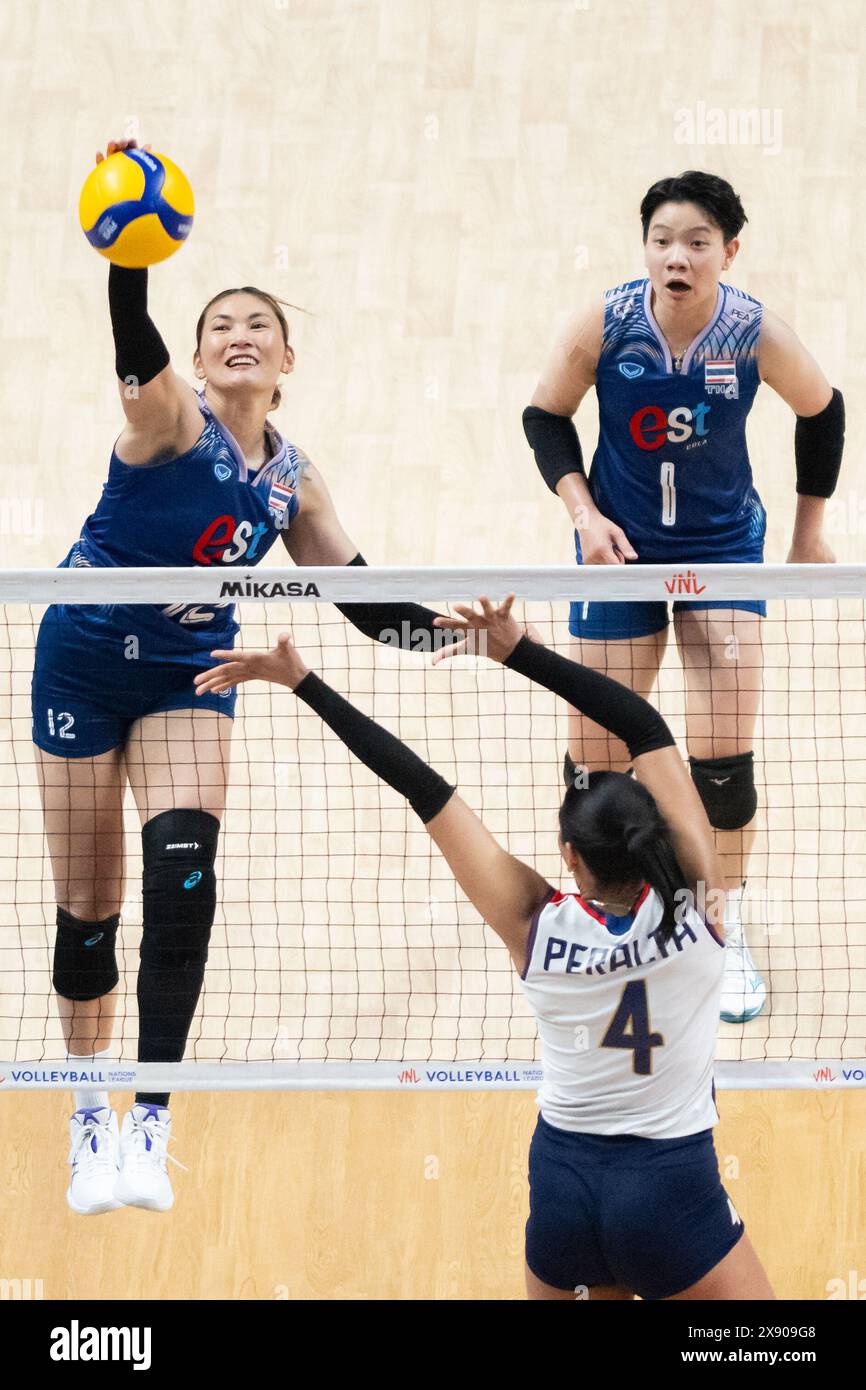 Macao, China. 28th May, 2024. Hattaya Bamrungsuk (L) of Thailand spikes the ball during the ...
