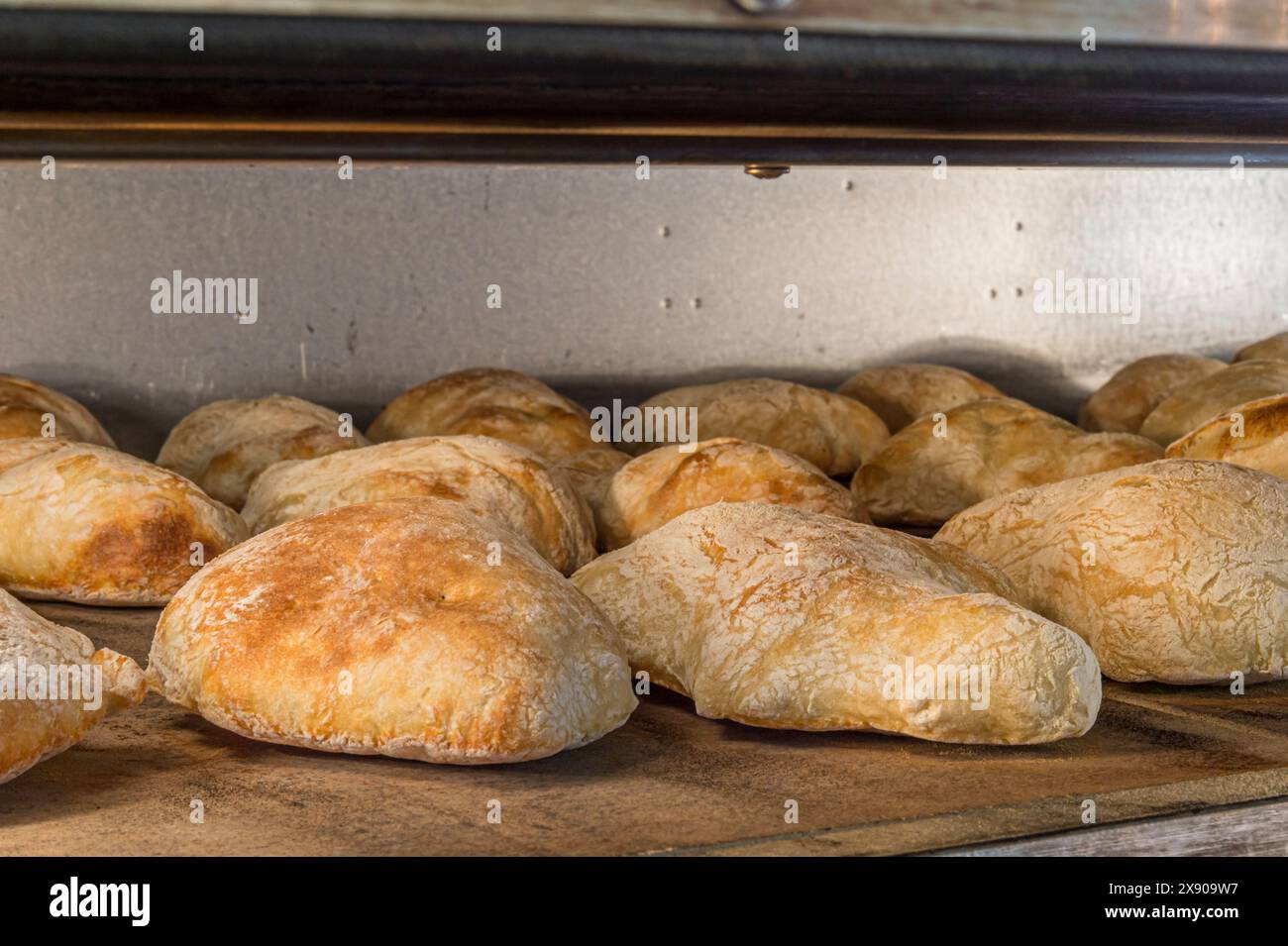 Many loaves of bread baking in oven Stock Photo - Alamy