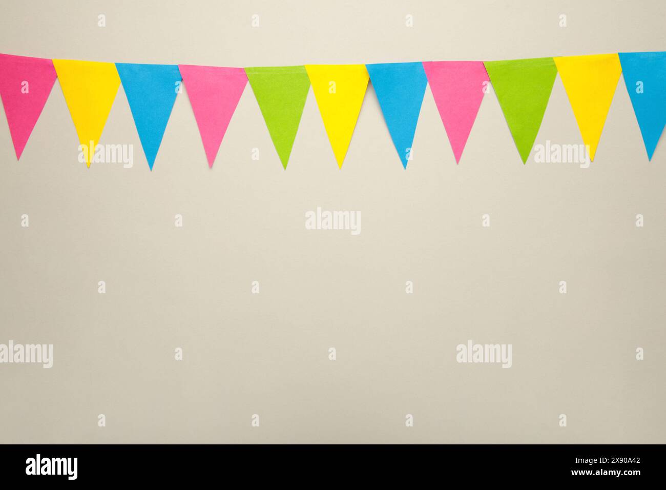 Hanging party flags on white background, decorate items for festival ...