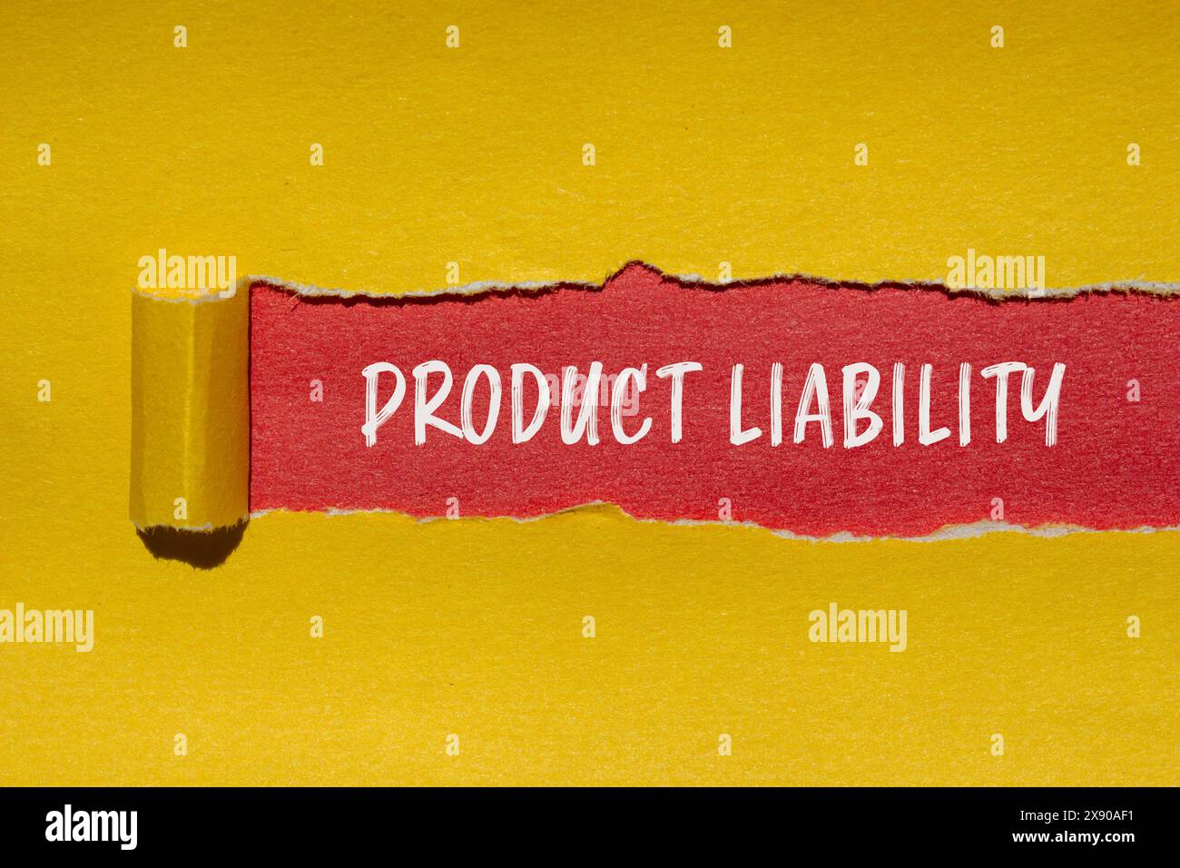 Product liability words written on ripped yellow paper with red ...