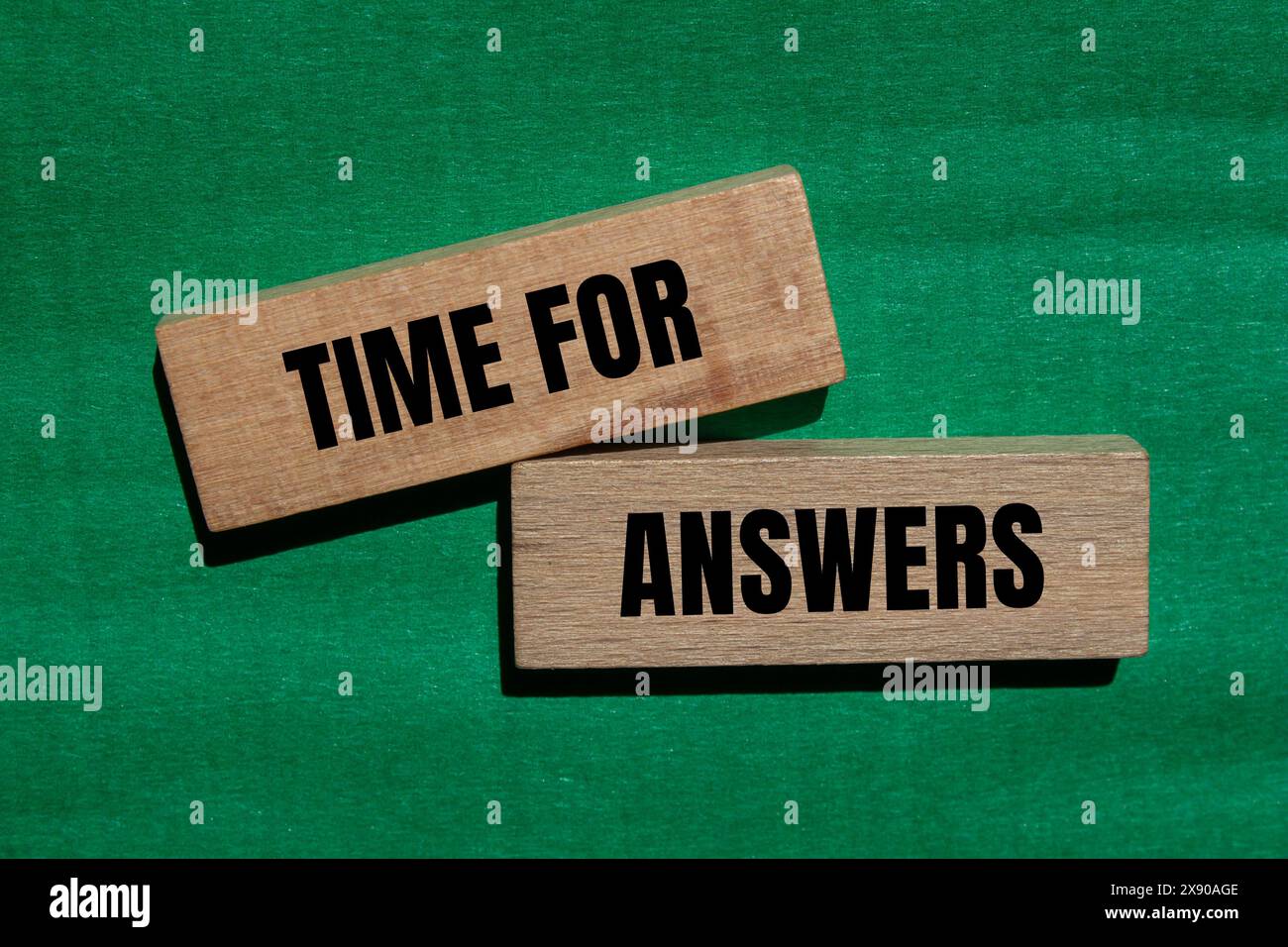 Time for answers words written on wooden blocks with green background ...