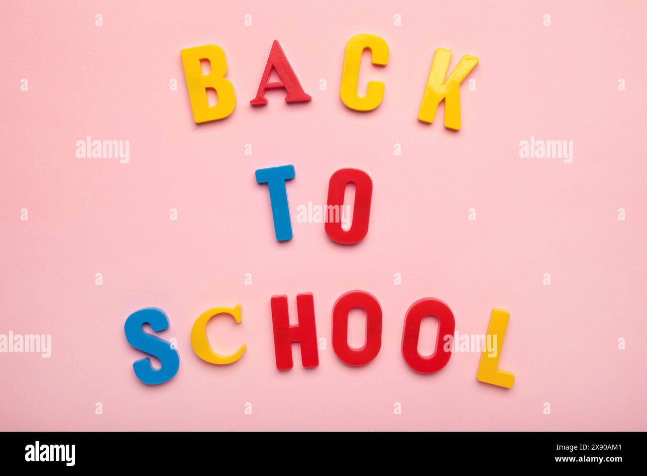 Back to School alphabet letters on pink background. Top view Stock ...