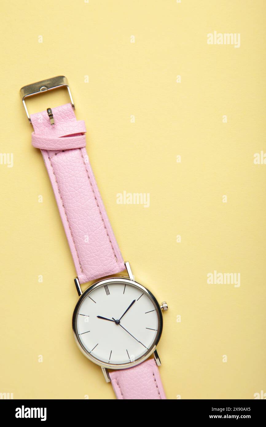 Pink wrist watches on beige background with copy space. Top view Stock ...