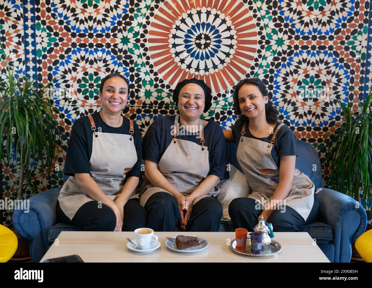 Three Moroccan sister women in their family Moroccan coffee business ...