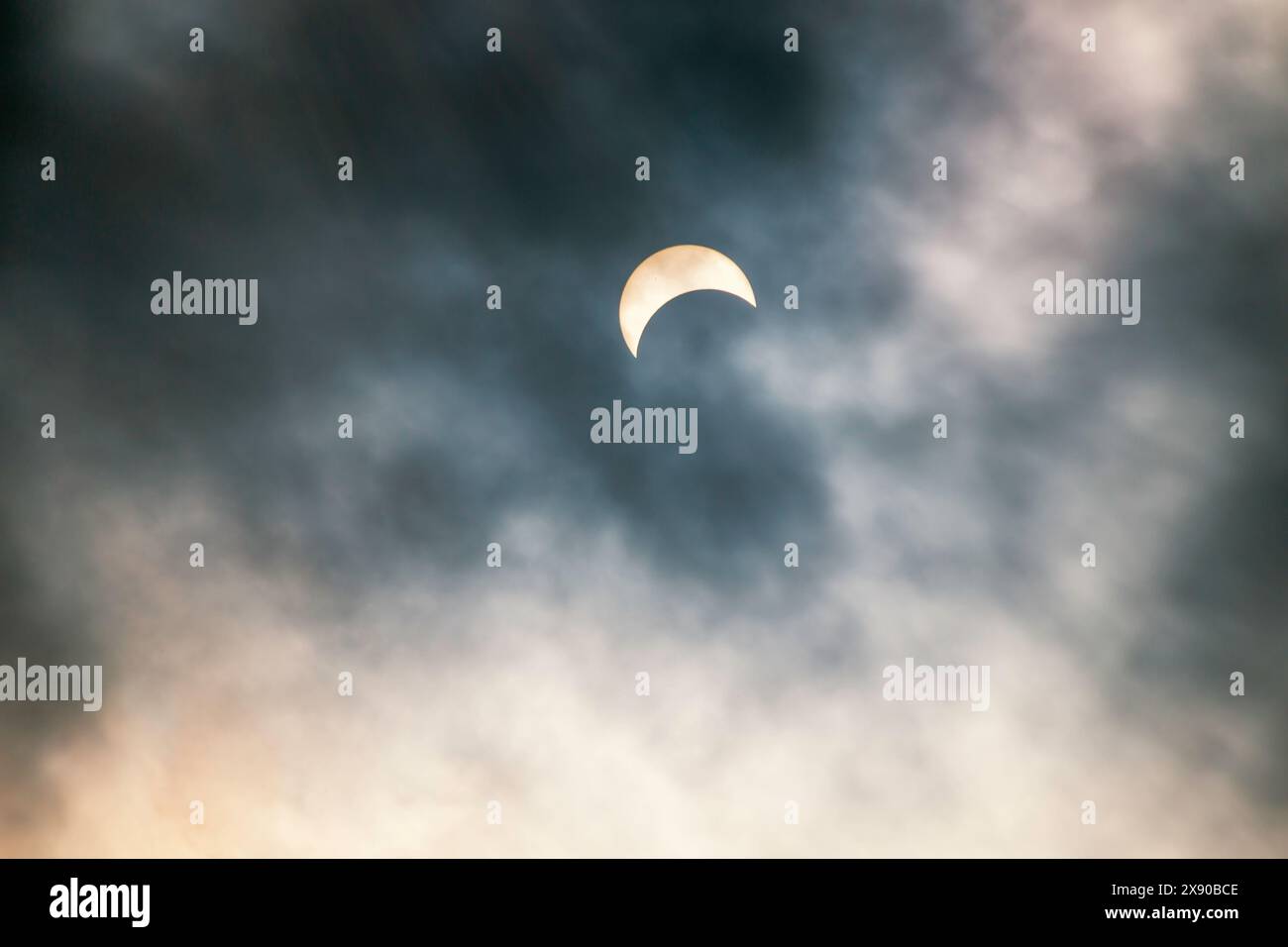 early stage of total Solar Eclipse seen through the clouds Hamilton ... early stage of total Solar Eclipse seen through the clouds Hamilton ...