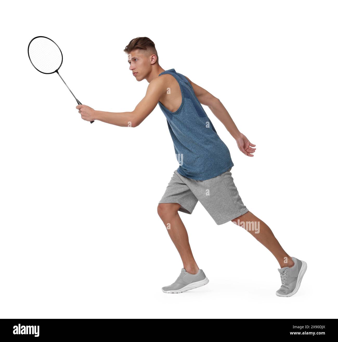 Young man playing badminton with racket on white background Stock Photo ...