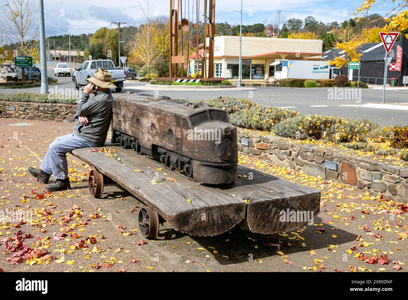 Walcha twon centre australian mat in hat talks on phone sitting on ...