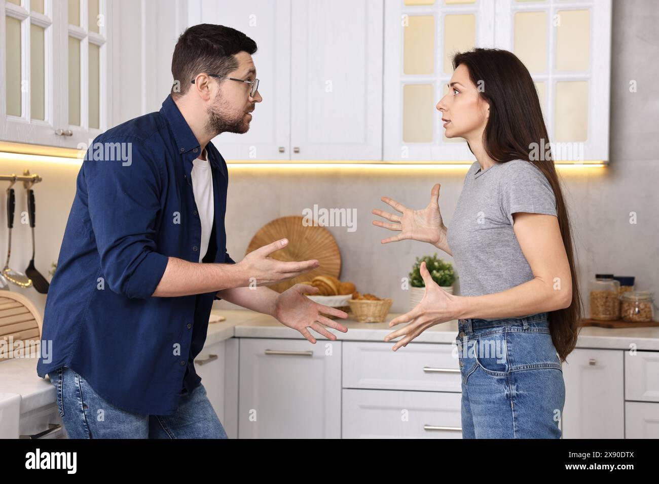 Emotional couple arguing in kitchen. Relationship problems Stock Photo ...