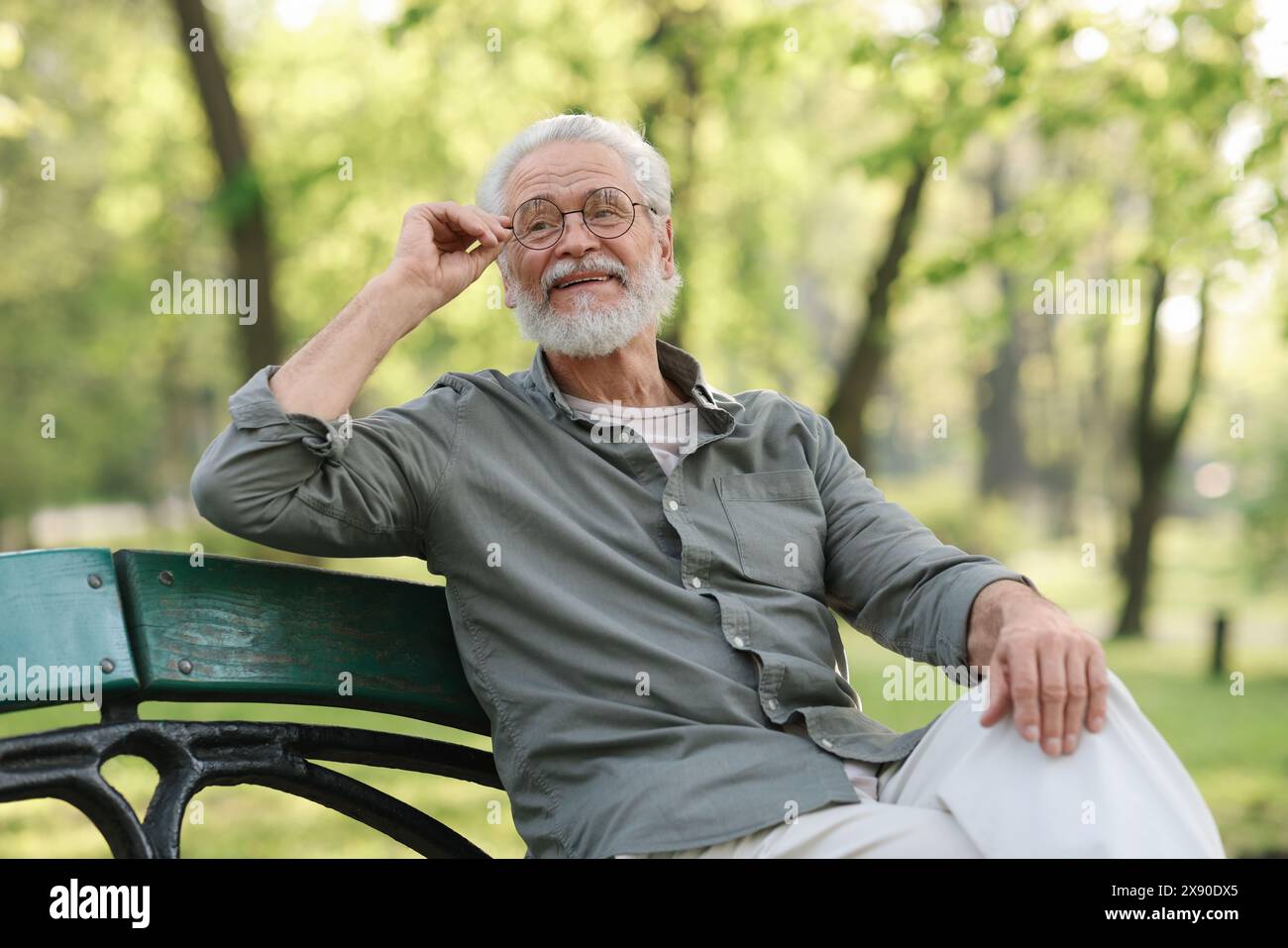 Portrait of happy grandpa with glasses on bench in park Stock Photo - Alamy