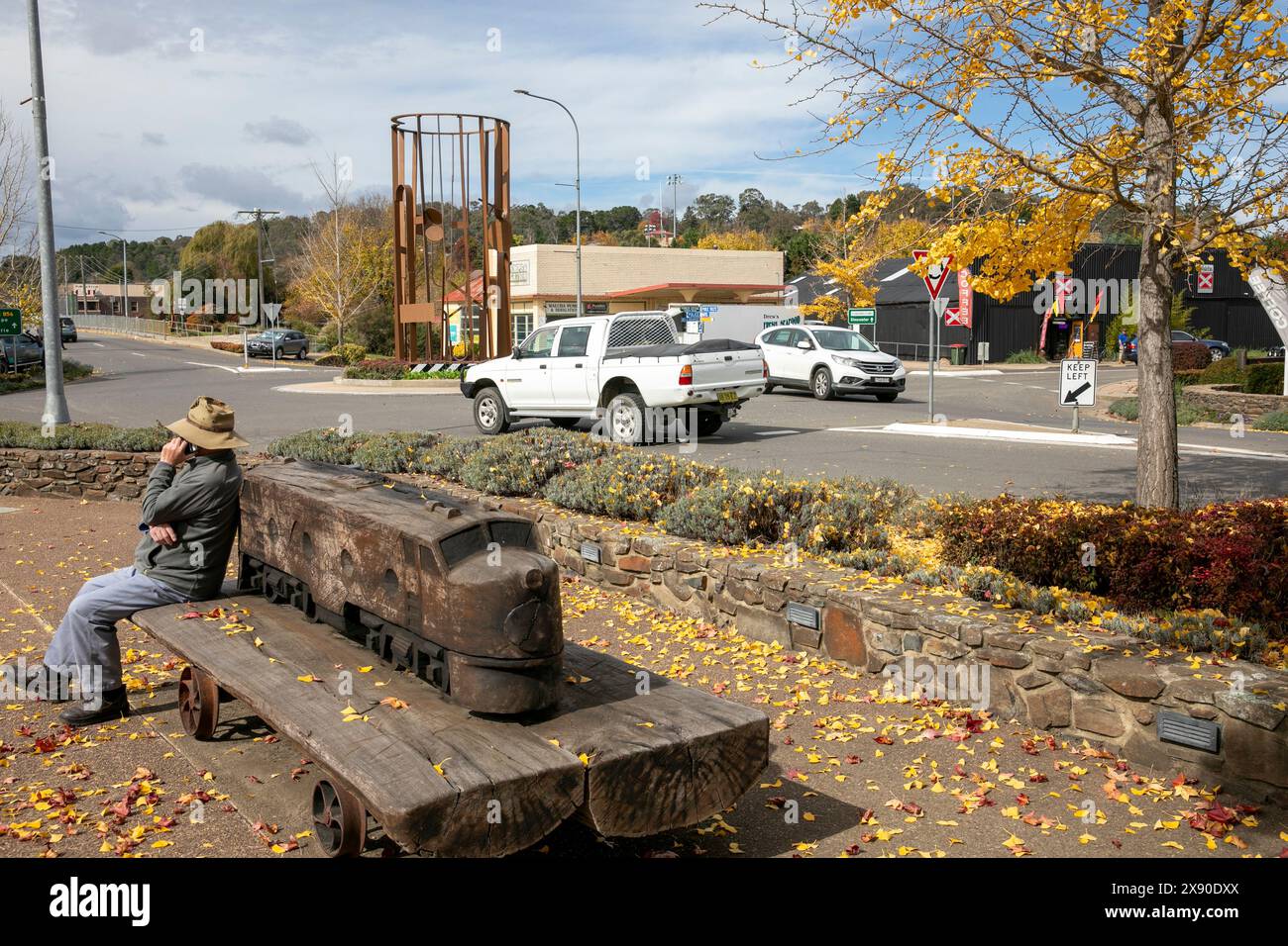 Walcha twon centre australian mat in hat talks on phone sitting on ...