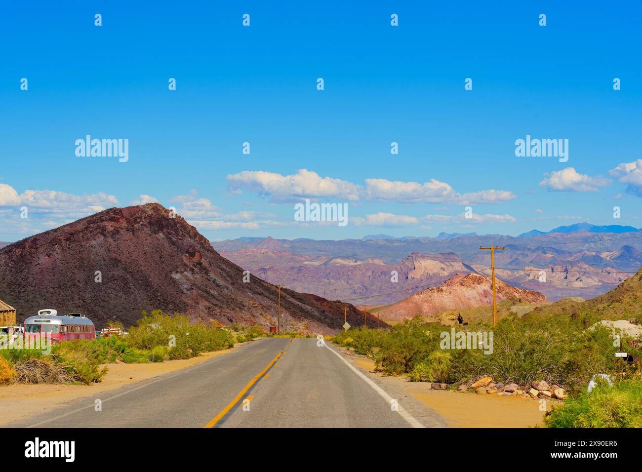 Nevada's captivating landscape, where the road stretches endlessly into ...