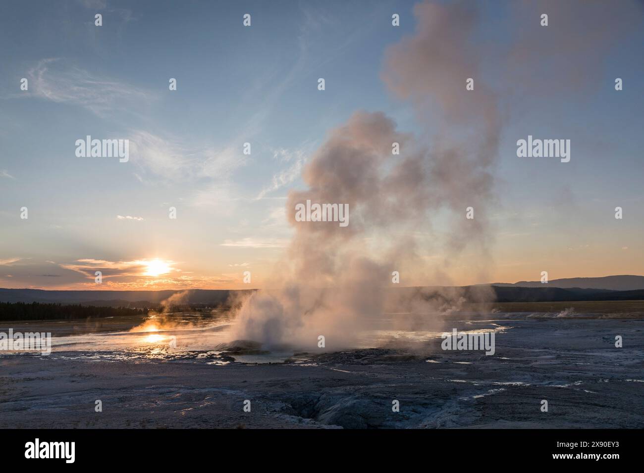 Sunset through erupting geyser, Lower Geyser Basin, Yellowstone ...