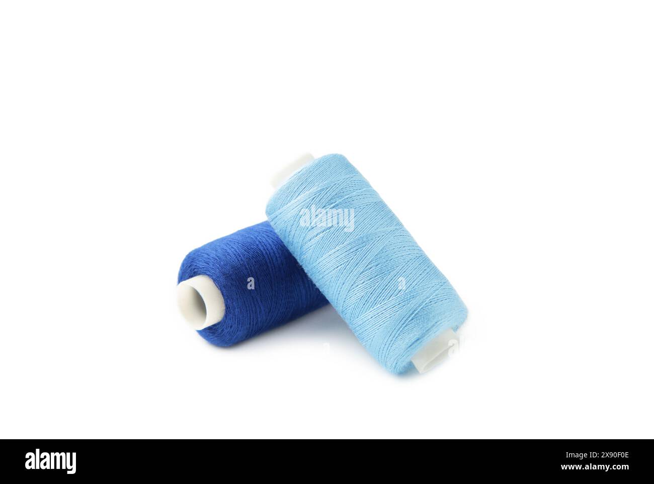 Blue sewing threads isolated on white background, top view Stock Photo ...