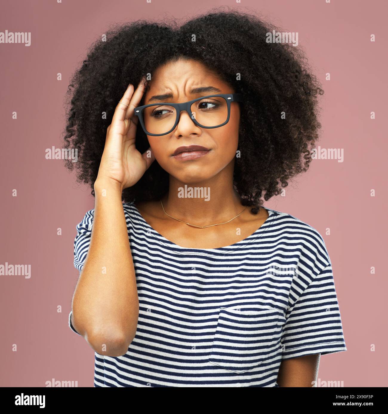 Stress, headache or girl with glasses in studio overwhelmed by brain ...