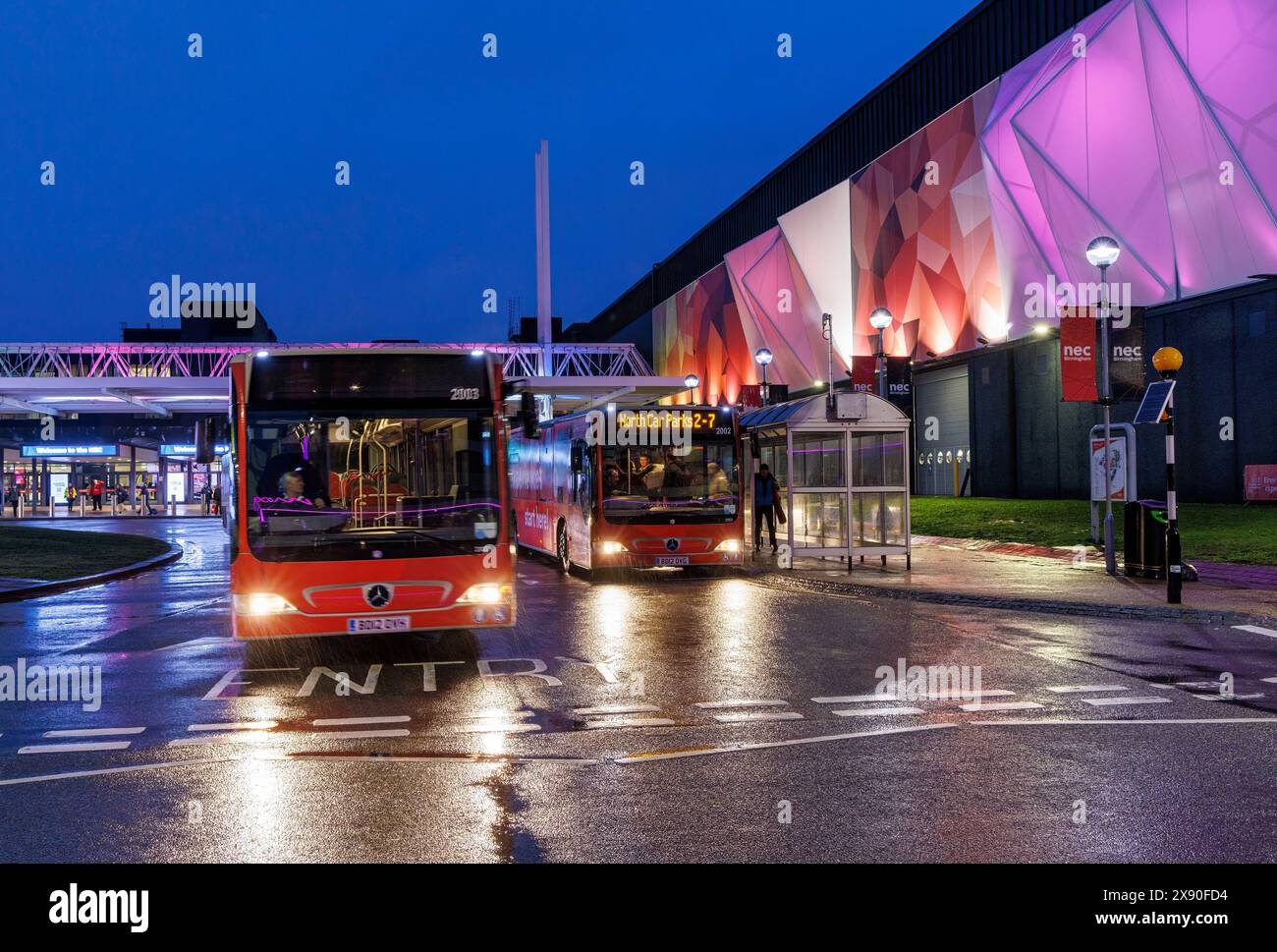 Buses leaving the NEC at dusk, Birmingham, England, UK Stock Photo - Alamy