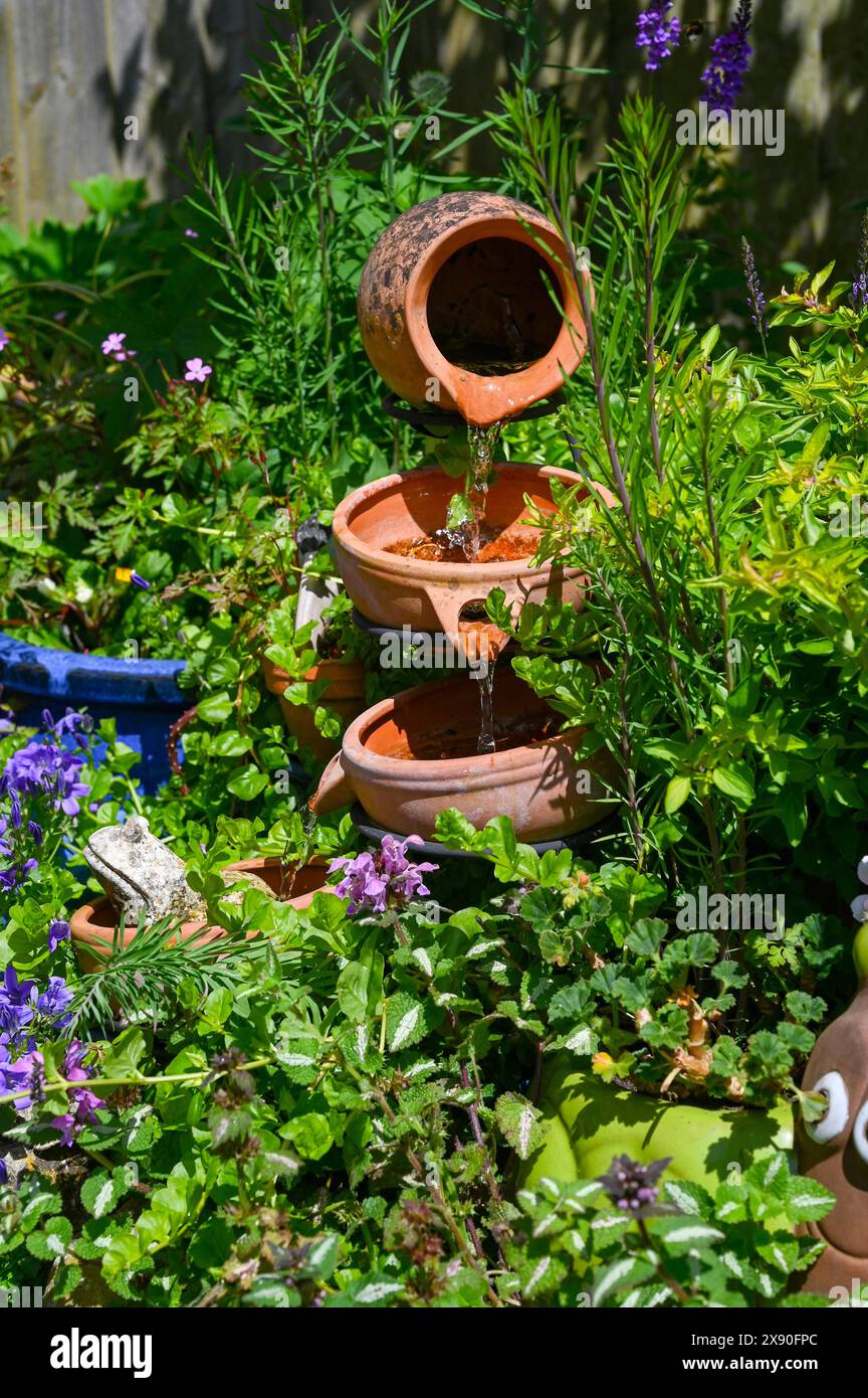 Small solar powered water feature in an urban city garden Stock Photo ...