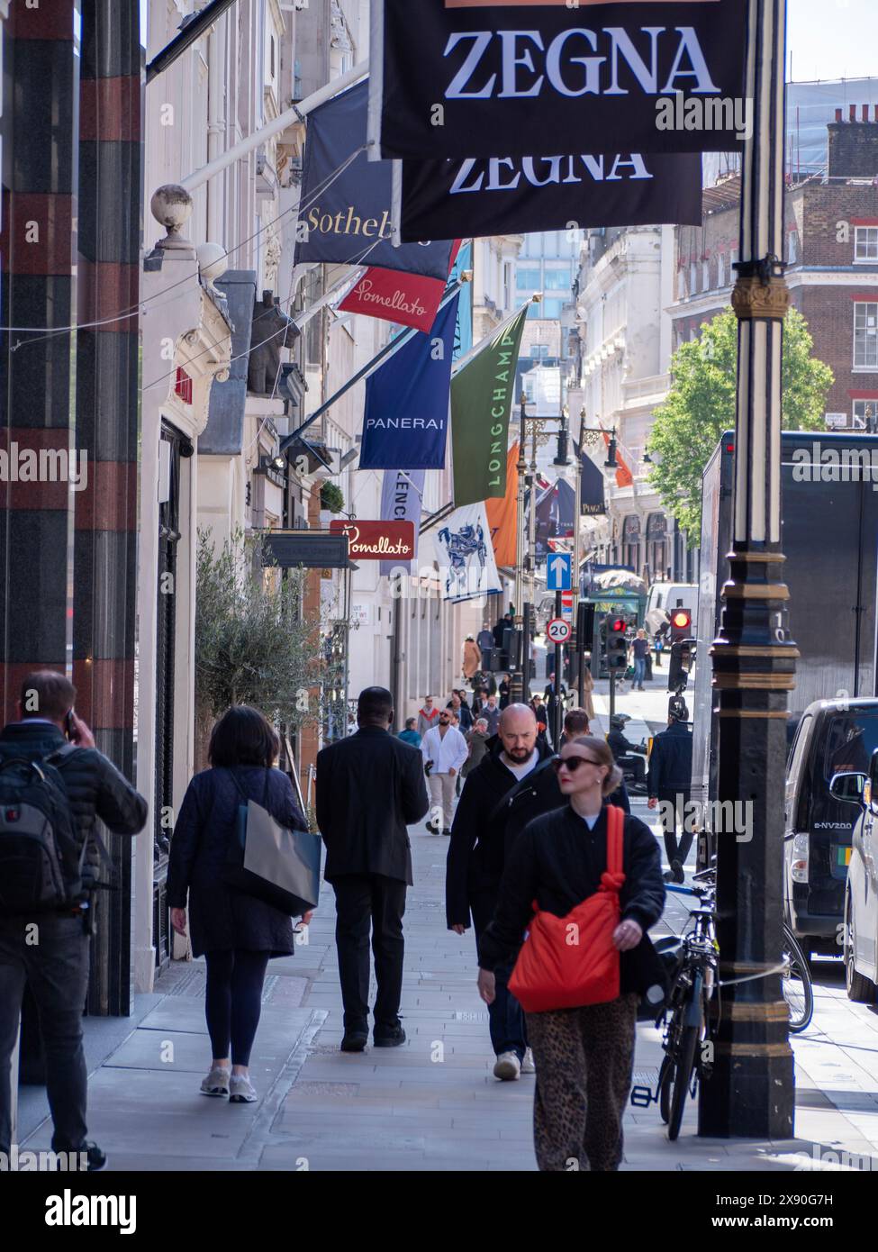 Luxury shopping stores and shoppers in New Bond Street, London UK Stock ...