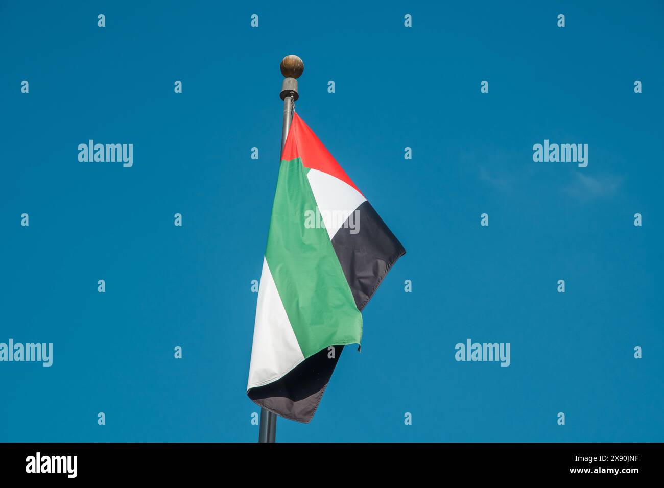 Dubai, UAE - January 6, 2024: The United Arab Emirates flag waves ...