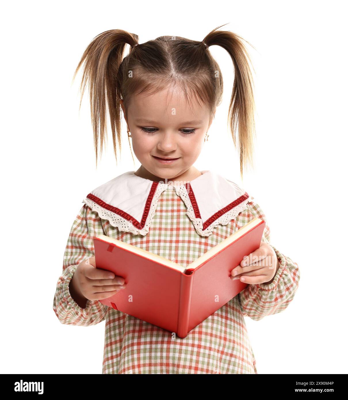Cute little girl reading book on white background Stock Photo - Alamy
