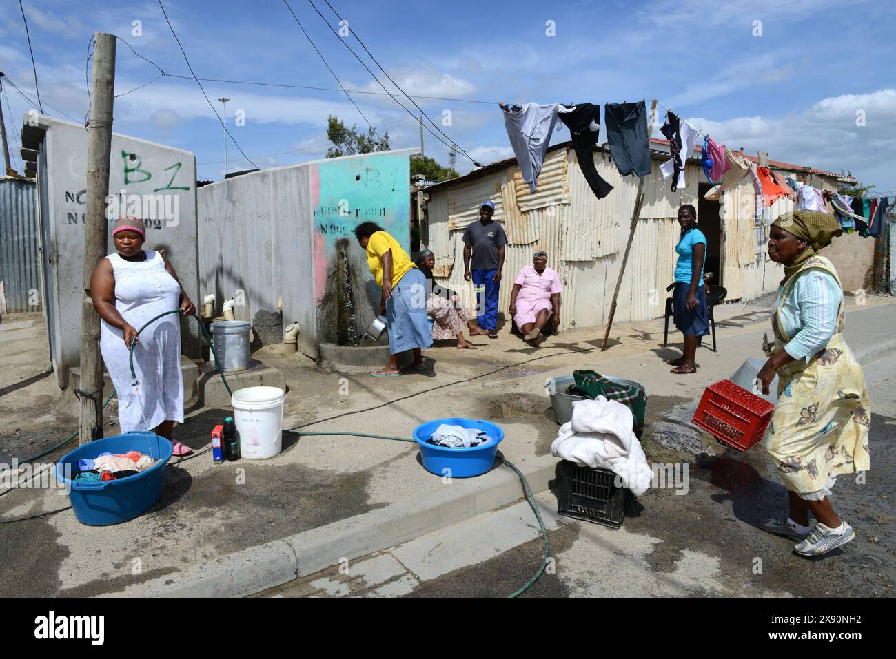 Typical street scene in an undeveloped area in Khayelitsha. Several ...