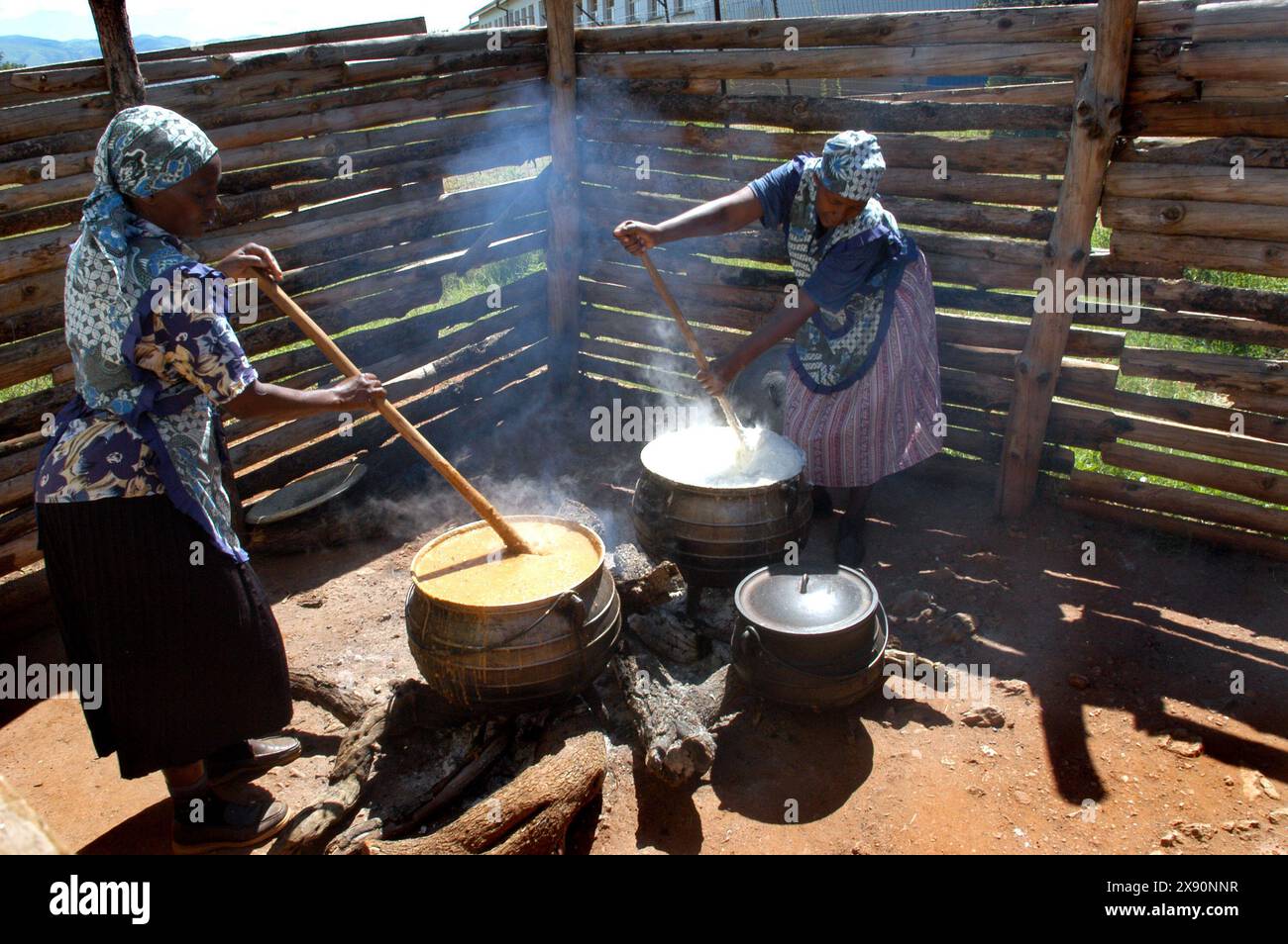 Rural school feeding scheme potjie food cooking two mothers cook food ...