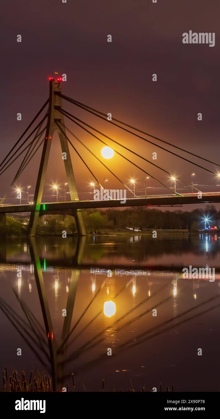 Full Moon rising on background bridge in Kyiv, Ukraine Stock Photo - Alamy