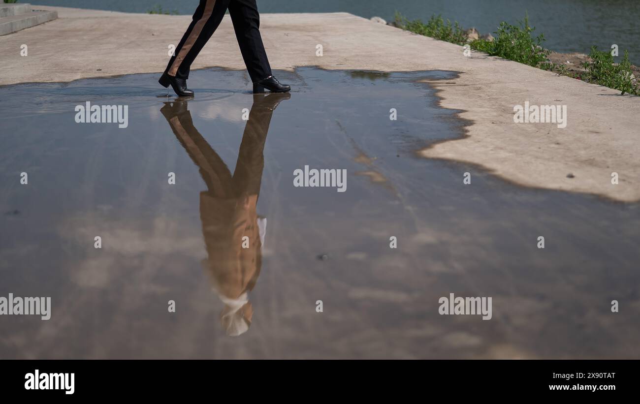Female walking through flood water hi-res stock photography and images ...