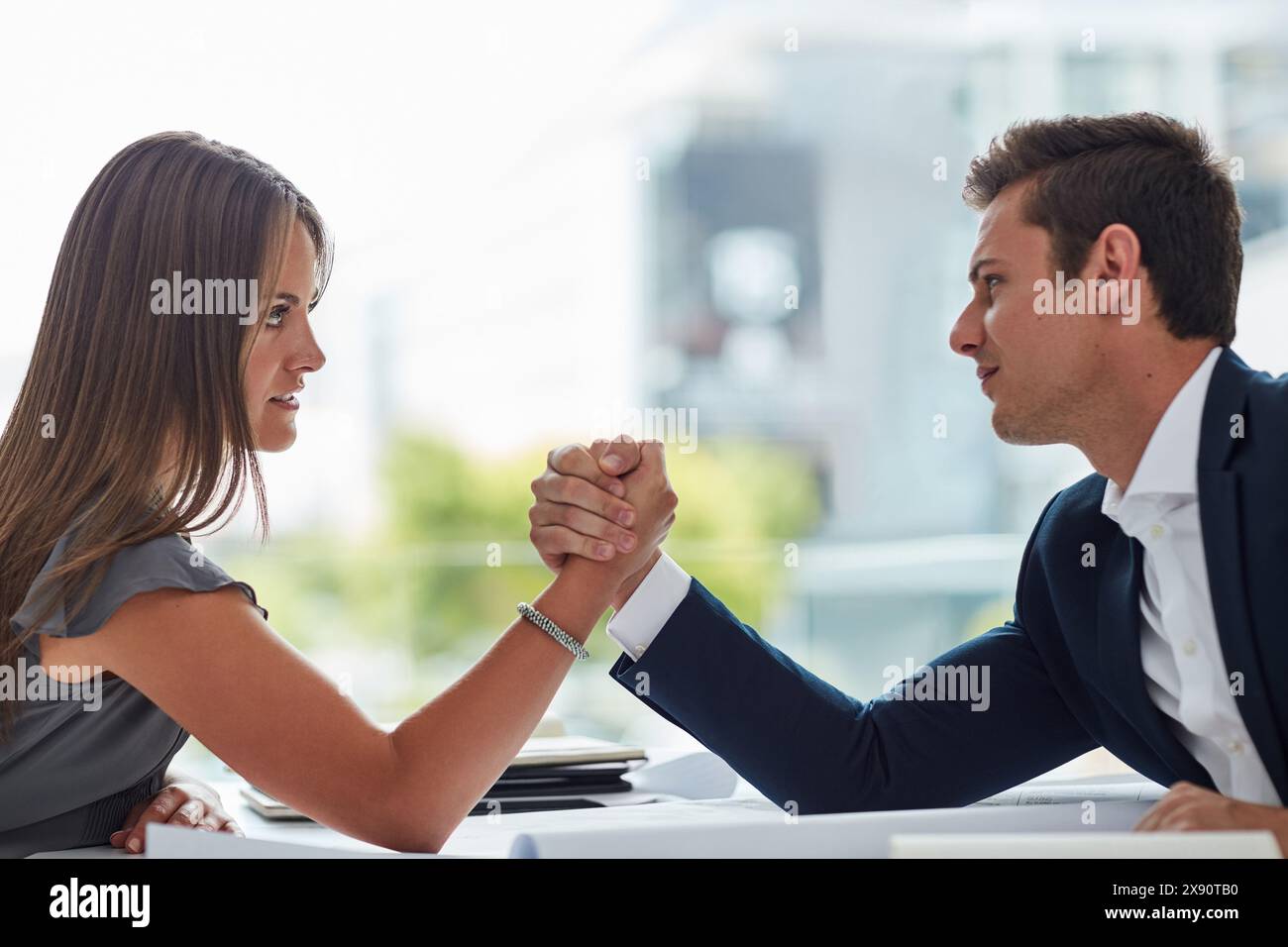 Office, business people and arm wrestle for challenge, competition and ...
