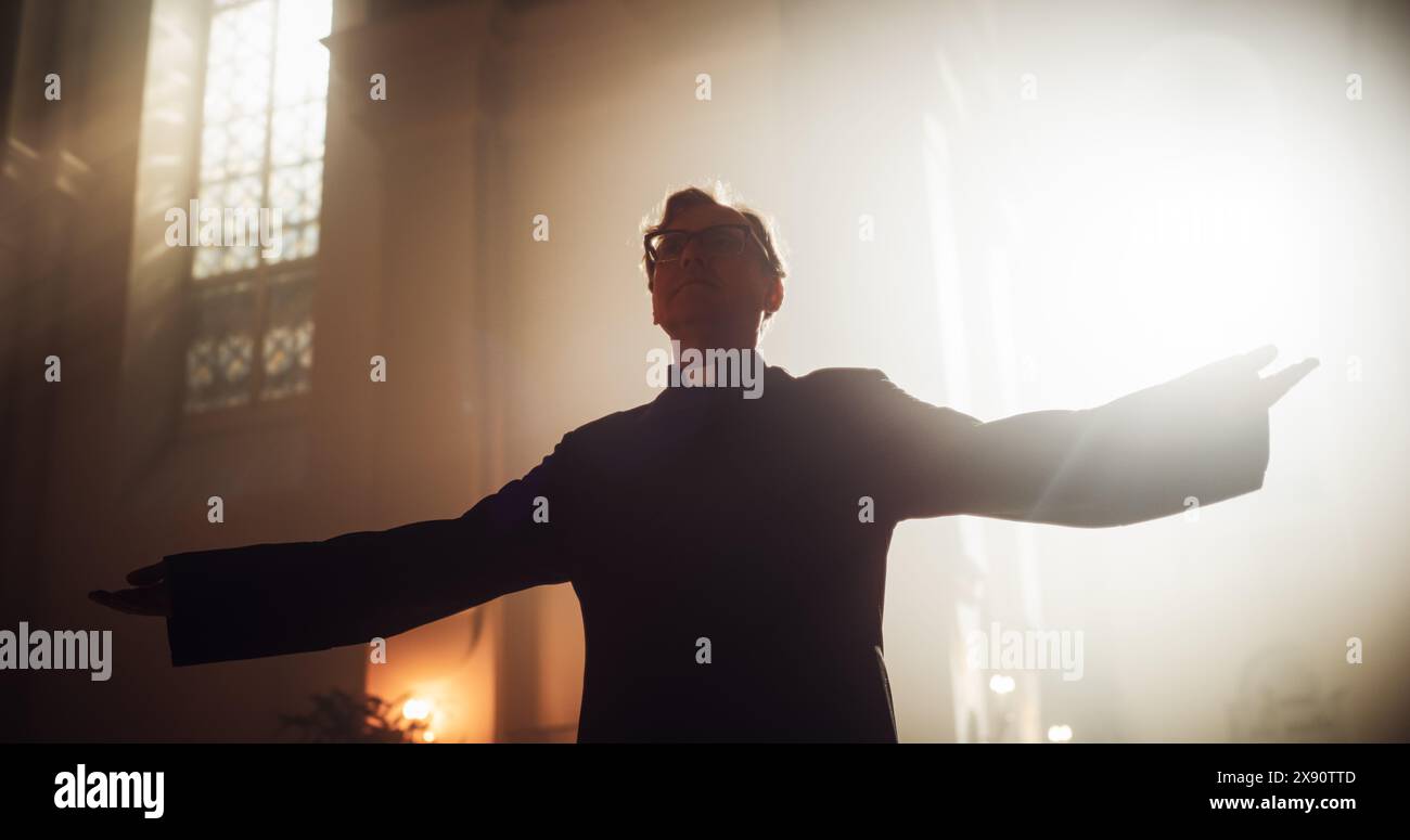 Portrait of Christian Priest Raising Hands In Blessing His Congregation ...