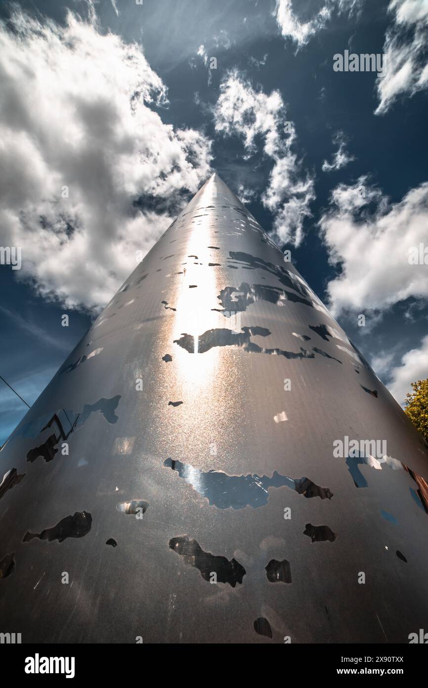 The Spire monument on the streets of Dublin from a low-angle view. The ...