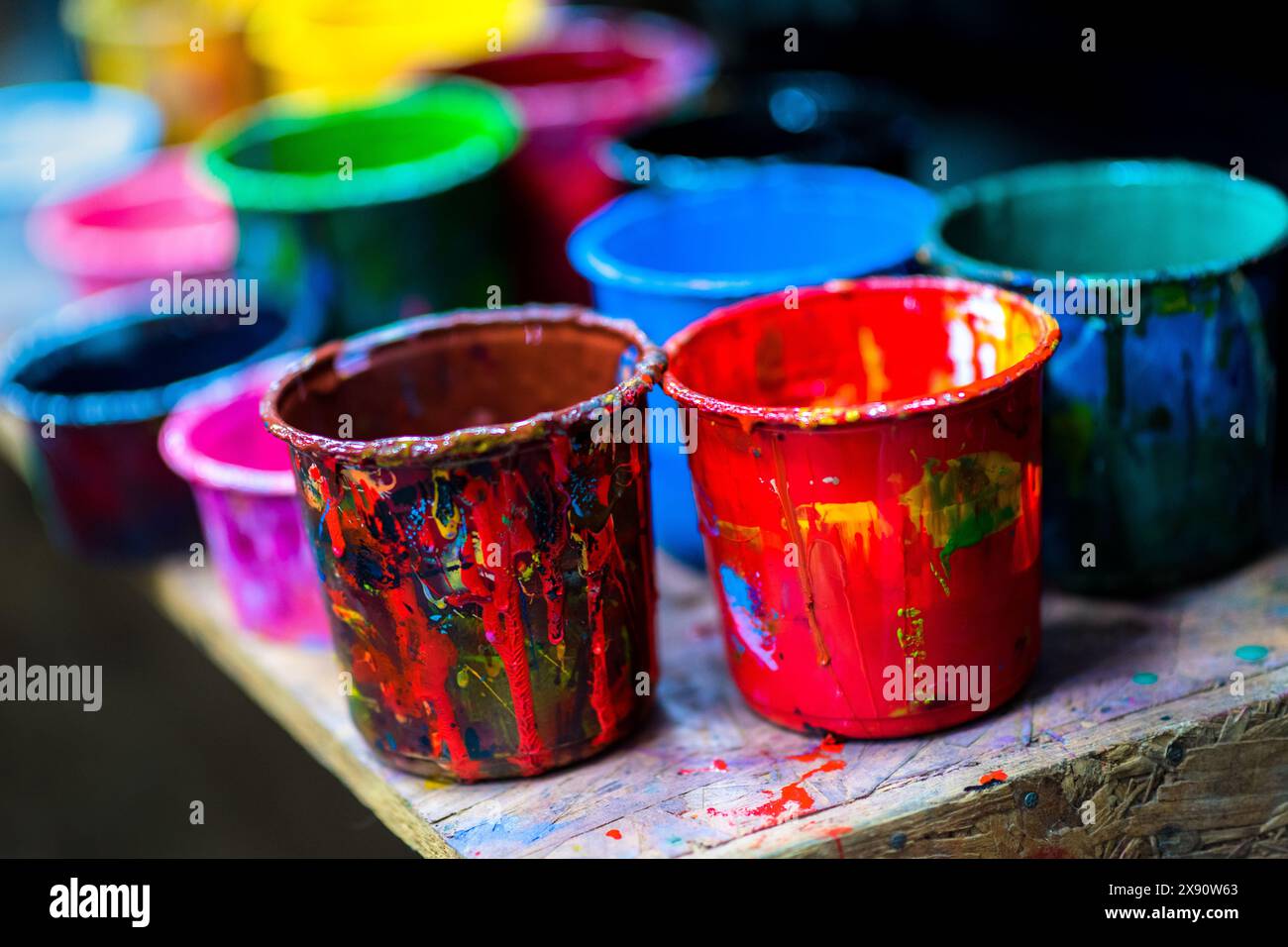 Buckets of printing inks are seen placed on the shelf at a printing ...