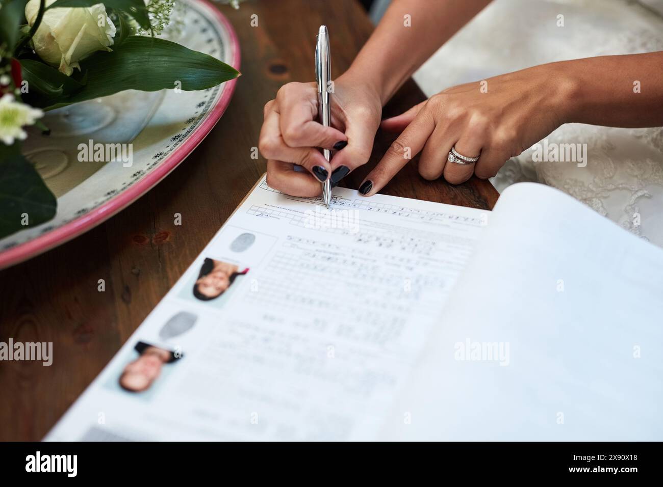 Wedding, documents and hand of woman with signature for legal contract ...