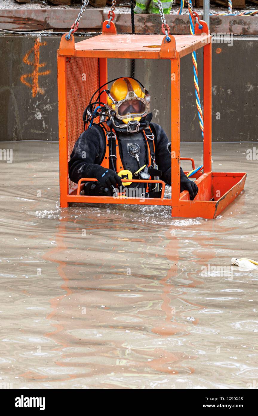 Henstedt Ulzburg, Germany. 28th May, 2024. A construction diver is ...